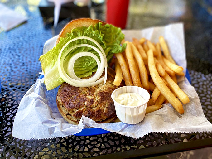 The star of the show! This crab cake sandwich isn't hiding behind fancy garnishes&mdash;just pure, lump blue crab meat with a golden crust.