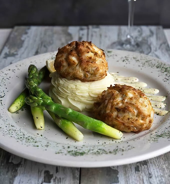 Behold, the holy grail of Maryland cuisine: crab cakes so perfectly golden and plump, they make other states' versions look like sad imitations.