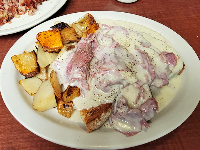 Creamed chipped beef that would make your grandmother weep with joy, served alongside home fries that achieve the perfect crisp-to-tender ratio.