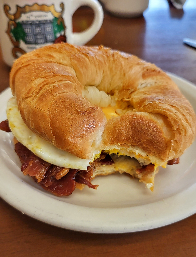 The star of the show: a golden croissant sandwich that makes you question why you ever settled for lesser breakfast options.