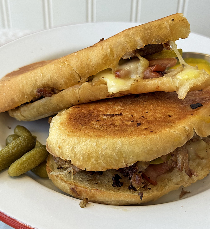 This Cuban sandwich isn't just lunch&mdash;it's architecture. Perfectly pressed bread houses layers of pork, ham, cheese, and pickles in harmonious balance.