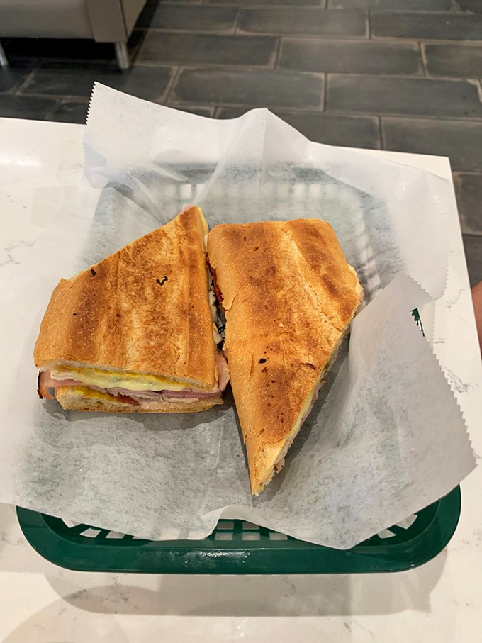 This pressed sandwich isn't just lunch&mdash;it's architecture. Golden, crispy exterior giving way to layers of savory goodness that would make a Cuban grandmother nod in approval.