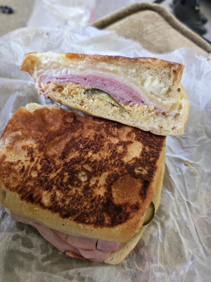 Behold the Cuban in all its pressed glory! That perfect harmony of ham, roasted pork, Swiss, pickles, and mustard that makes you wonder why you'd eat anything else.