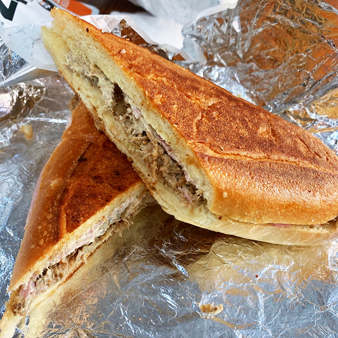 The legendary Cubano in all its pressed, golden glory. That perfect crunch giving way to succulent pork and ham is what sandwich dreams are made of.