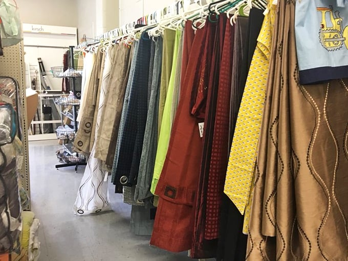 Curtains and colors dance together in this textile treasure trove. Fashion from every decade hangs in suspended animation.