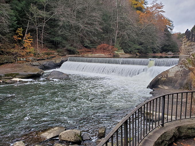 Beyond the bridge, Slippery Rock Creek cascades over a picturesque dam, creating a soothing soundtrack that's been playing on repeat since the glaciers retreated.