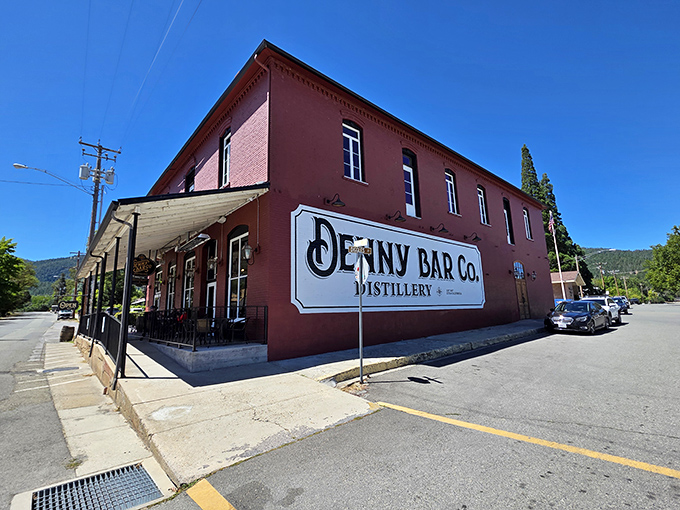 Denny Bar Company stands proudly in brick-red glory, a craft distillery where spirits are raised in more ways than one.