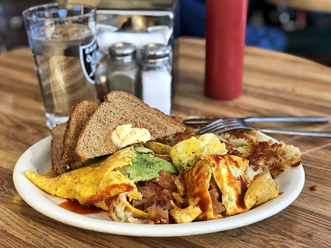 Behold the Denver Omelet in its natural habitat&mdash;where perfectly folded eggs embrace ham, peppers, and onions in a dance as old as breakfast itself.
