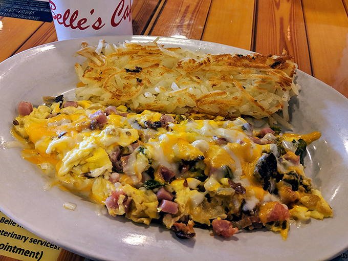 This scramble doesn't just have ham&mdash;it's having a party with melted cheese and crispy hash browns that weren't invited but showed up anyway.