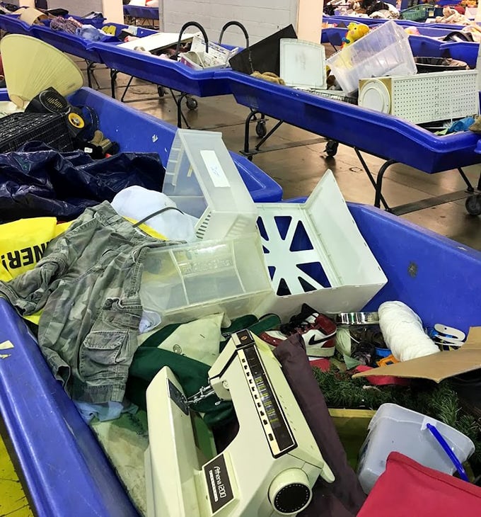 A snapshot of bin life in full swing. The colorful array of clothing creates a textile landscape where patient hunters sift through layers of possibility.