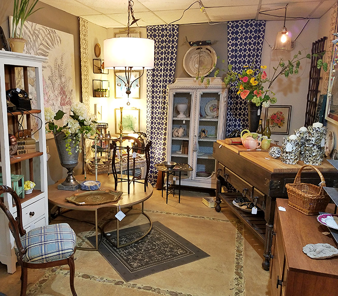 A vignette that whispers "come sit awhile" with its perfectly mismatched elegance and lighting that flatters both the furniture and its admirers.