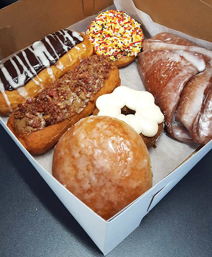A box of pure joy&mdash;each donut a different personality. It's like the Avengers of pastry, if the Avengers were delicious and covered in glaze.