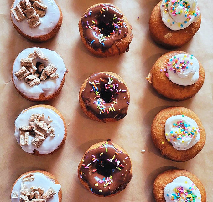 Donut nirvana achieved! These handcrafted beauties sport toppings from classic sprinkles to cereal crunch, each one a perfect handheld joy.