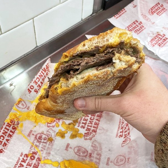 Behold the cross-section of perfection&mdash;ribbons of beef embraced by melted cheese in a crusty-yet-soft roll sanctuary.