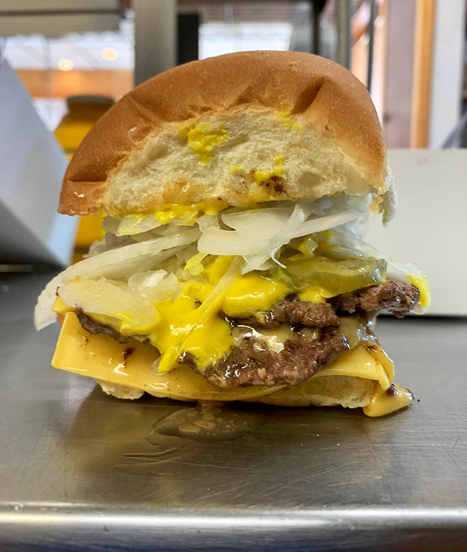 Behold the double cheeseburger in all its glory&mdash;where melted cheese cascades over perfectly seared patties like a yellow waterfall of joy.