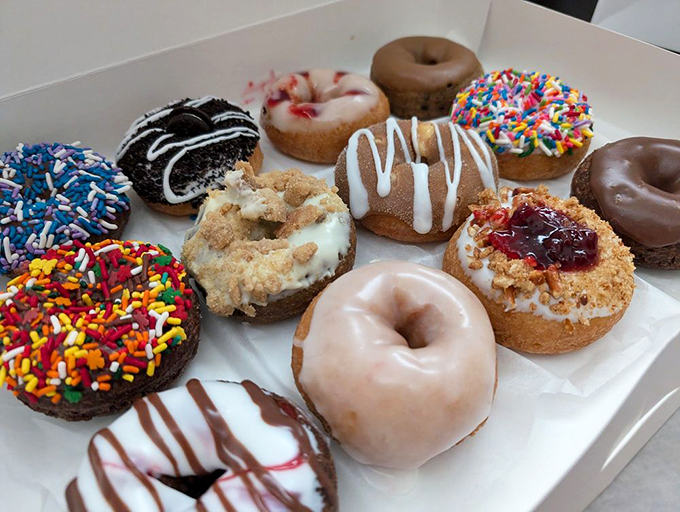 A box of possibilities! Each donut a different personality—from the party animal covered in sprinkles to the sophisticated one draped in raspberry glaze.