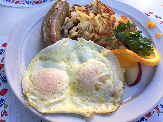 Sunny-side up perfection alongside crispy hash browns and Danish sausage &ndash; a breakfast trinity that proves sometimes the classics just can't be improved upon.