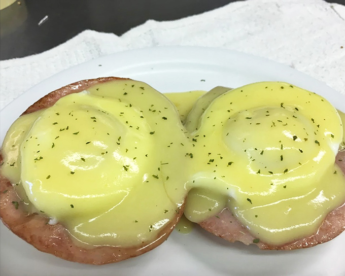 Eggs Benedict isn't just breakfast&mdash;it's a golden-hued masterpiece where perfectly poached eggs meet hollandaise in a morning romance that would make Shakespeare weep.