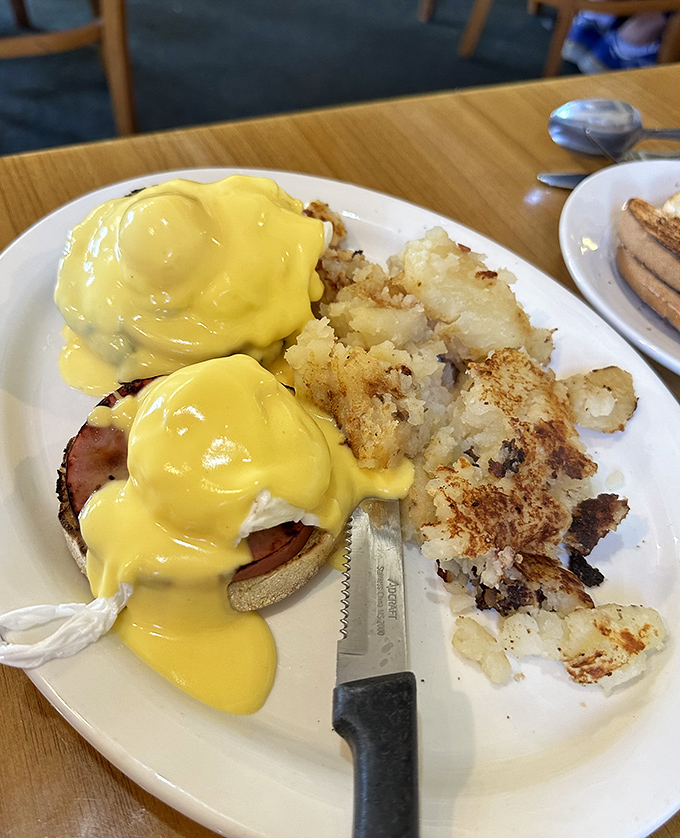 This is the Eggs Benedict that launches a thousand weekend drives &ndash; golden hollandaise perfection.