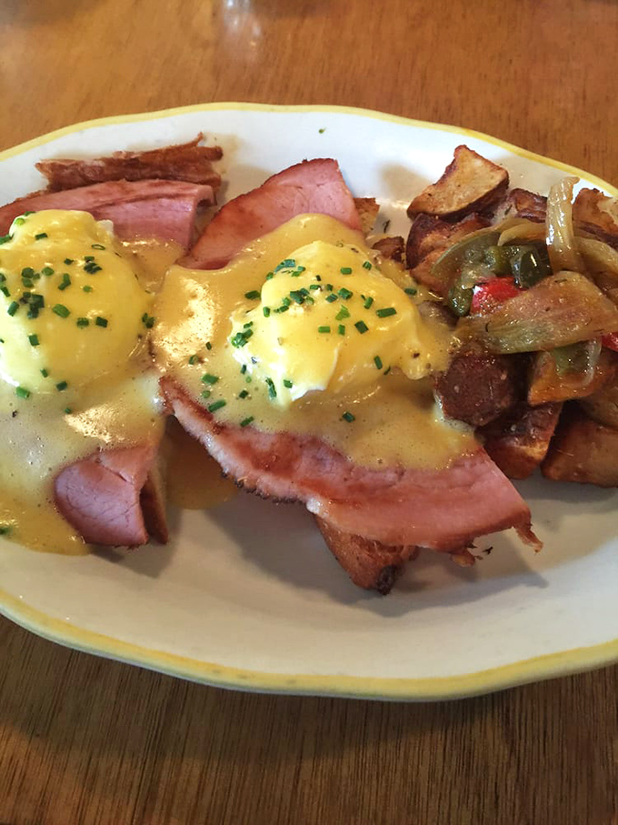 Behold the star attraction: Eggs Benedict that justifies the pilgrimage. Those golden yolks are about to create a sauce situation that'll make you weak in the knees.