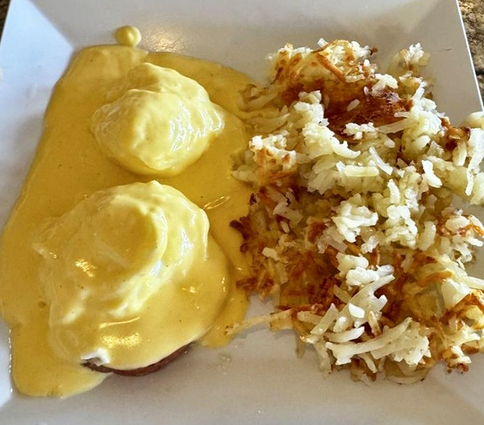 Behold the eggs Benedict in all their golden glory! That hollandaise sauce cascades like a buttery waterfall of happiness.