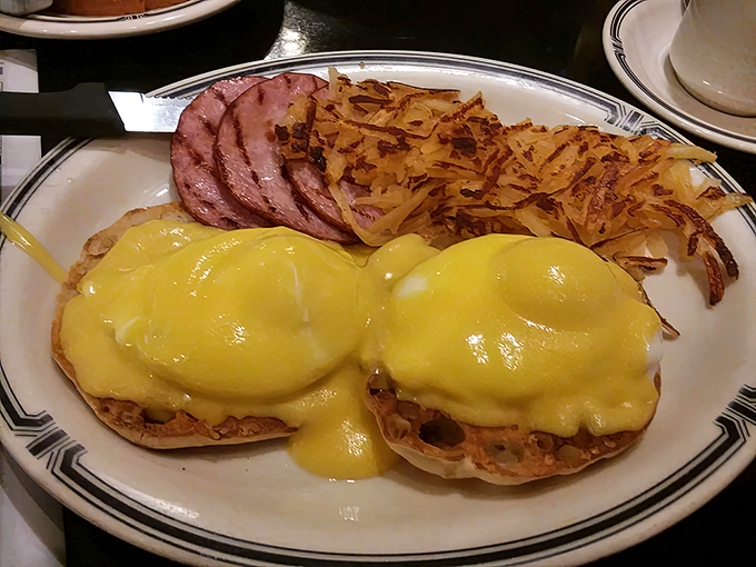 Behold the golden perfection: eggs Benedict that would make even Gordon Ramsay weep with joy.