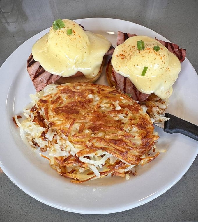 Behold, the star of the show: Glo's classic Eggs Benedict with perfectly poached eggs wearing their hollandaise coats like royalty atop a throne of ham and English muffin.