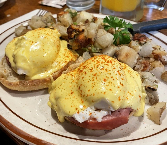 Behold the Benedict that launched a thousand return trips &ndash; perfectly poached eggs, velvety hollandaise, and those home fries that refuse to be upstaged.