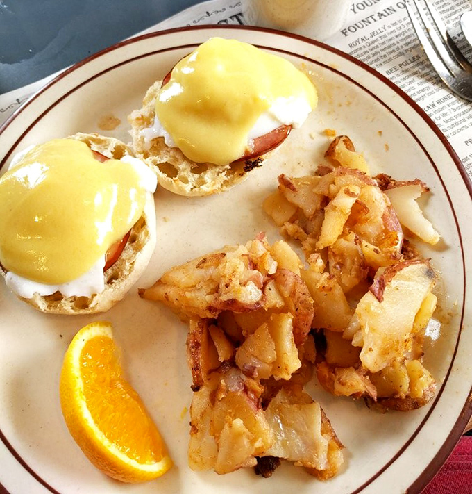 Eggs Benedict that would make the Pope jealous. Those home fries look like they've achieved the perfect crisp-to-tender ratio&mdash;a culinary miracle.
