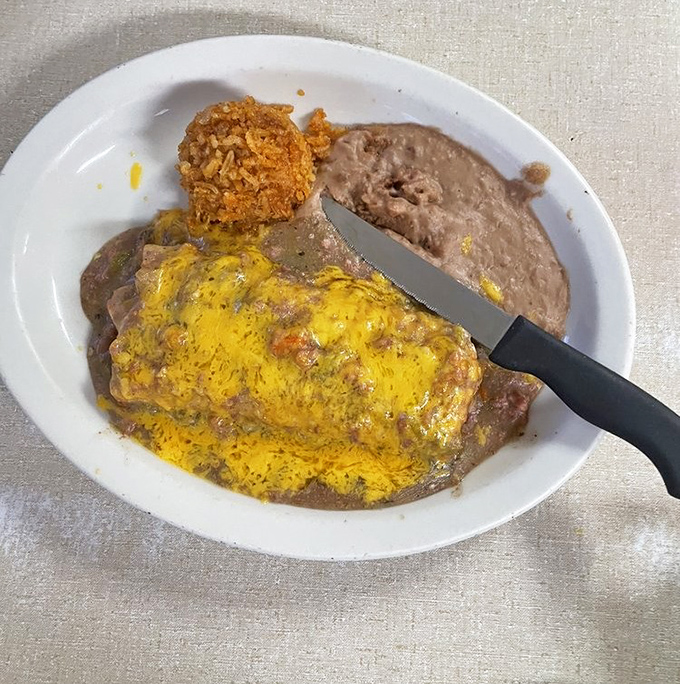 This enchilada plate isn't just food; it's edible geography&mdash;a perfect representation of Arizona's culinary heritage smothered in melted cheese and authentic sauce.