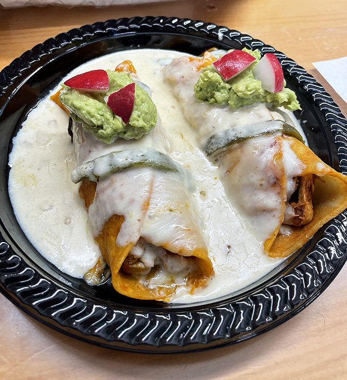 Cheese blankets these enchiladas like a warm hug, while the avocado and radish garnish add that perfect pop of color and freshness.