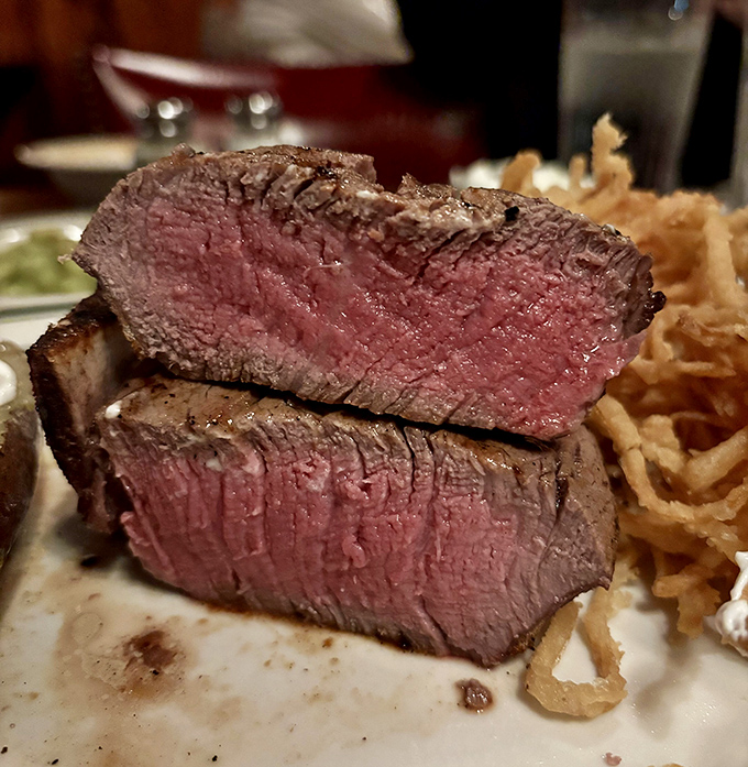 This isn't just a steak; it's a masterpiece of timing and technique. The filet's perfect pink center whispers, "This is why you came."