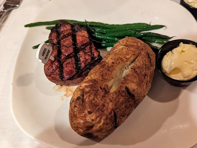 A perfectly medium-rare filet mignon that doesn't need a pardon &ndash; accompanied by a baked potato that could stand trial on its own merits.