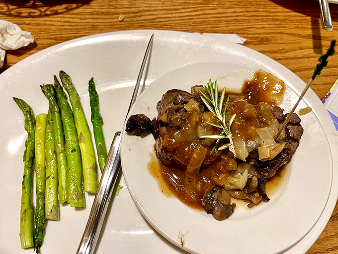 This isn't just filet mignon&mdash;it's a masterclass in meat preparation, complete with asparagus standing at attention like delicious green soldiers.