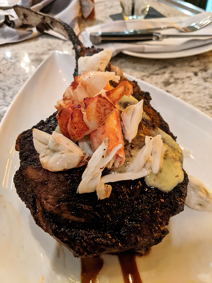 Surf meets turf in spectacular fashion &ndash; a perfectly charred steak crowned with succulent lobster meat and a dollop of compound butter.