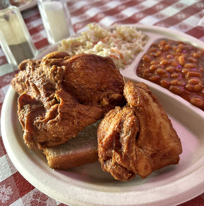 The holy grail of fried chicken &ndash; that mahogany crust holding secrets older than most Kentucky bourbon. Worth crossing state lines for.