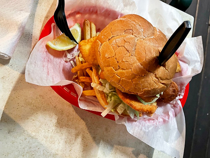 Behold: the legendary fish sandwich that launched a thousand road trips. Golden, crispy perfection nestled in a bun with fries standing by for backup.