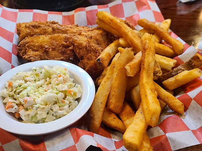 This is what fish and chips dreams are made of - golden, crispy perfection with proper thick-cut chips and creamy slaw.