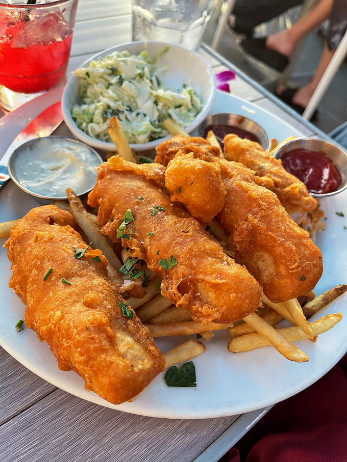 Golden-battered fish and chips that would make a British pub jealous. That perfect crunch is the sound of happiness in food form.