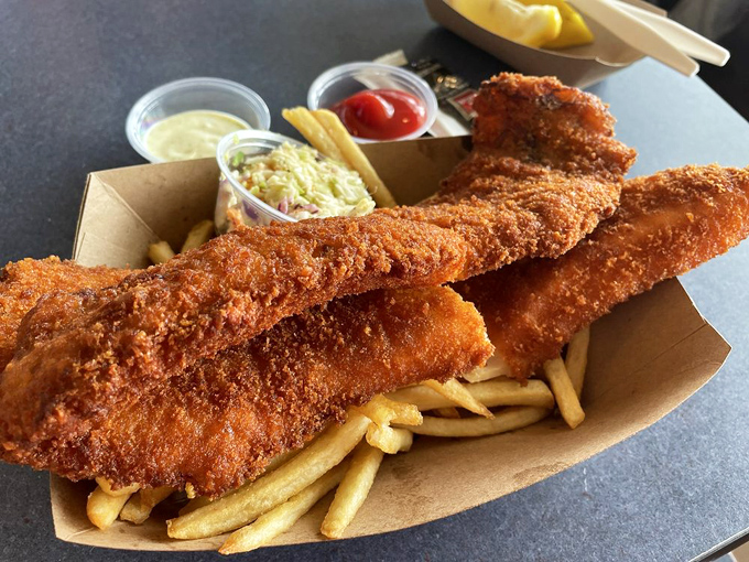 Golden, crispy fish and chips that would make a British pub jealous, served in a cardboard boat ready to sail into your stomach.