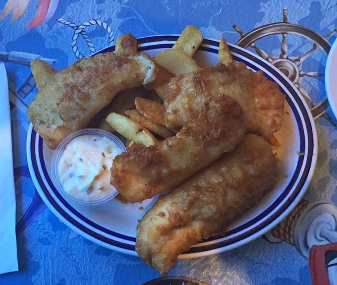 Golden-battered fish and chips that would make a British pub jealous. That tartar sauce cup isn't nearly big enough for the dipping marathon you're about to embark on.