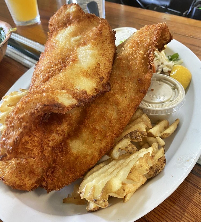 Golden-battered fish that shatters with each bite, paired with perfectly crisp waffle fries. This is what the sea gods eat on their day off.