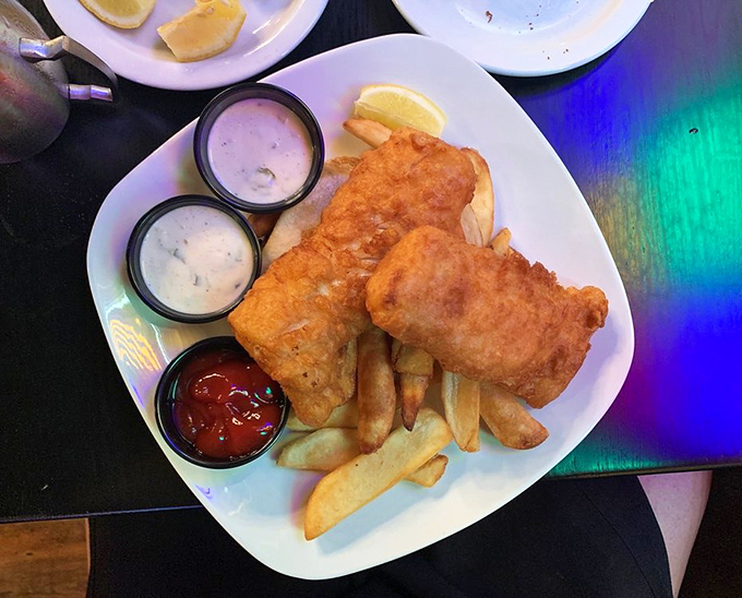 Golden-battered fish and chips arrive with three dipping options &ndash; because sometimes life's biggest dilemma should be "tartar sauce or ketchup?"