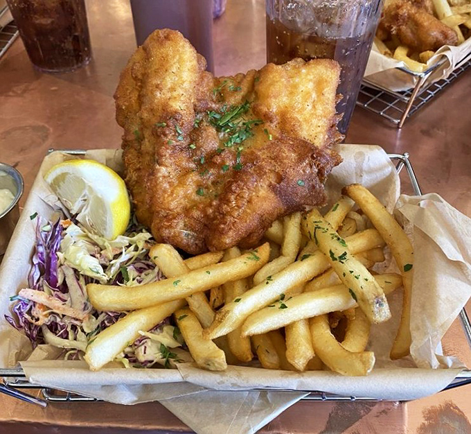 Golden perfection meets crispy heaven - fish and chips that would make the Queen herself consider relocating.