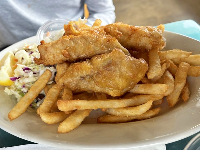 Golden-battered fish that shatters with each bite, paired with perfectly crisp fries. This isn't just fish and chips&mdash;it's an edible postcard from the Pacific.