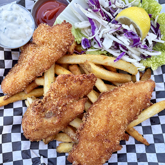 Golden-brown perfection that makes other fish and chips hang their heads in shame. That slaw isn't a side dish—it's a palate-refreshing necessity.