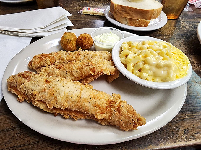 Golden-fried fish that would make coastal restaurants jealous, paired with mac and cheese that tastes like childhood memories.