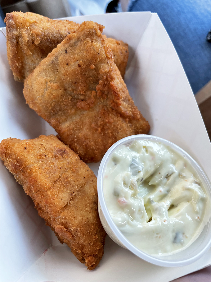Golden triangles of perfectly fried fish with creamy tartar sauce &ndash; a crispy-on-the-outside, tender-on-the-inside masterpiece worth crossing town for.