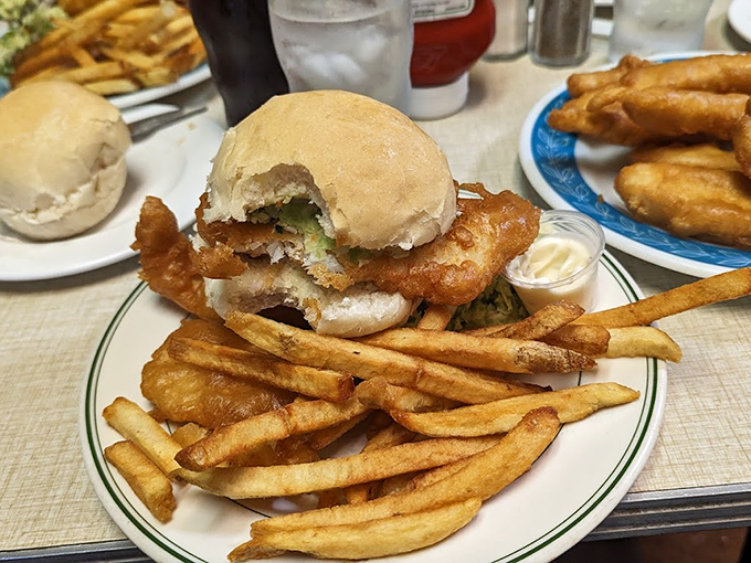 The fish sandwich: where perfectly fried cod plays hide-and-seek between a humble bun, creating a handheld masterpiece that puts fast food to shame.