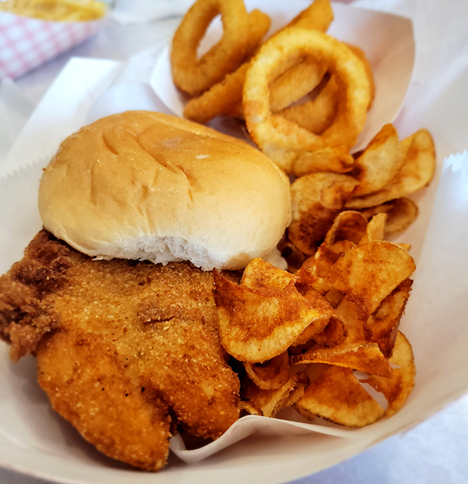 Golden perfection meets comfort food bliss in this crispy fish sandwich that rivals any coastal competition.